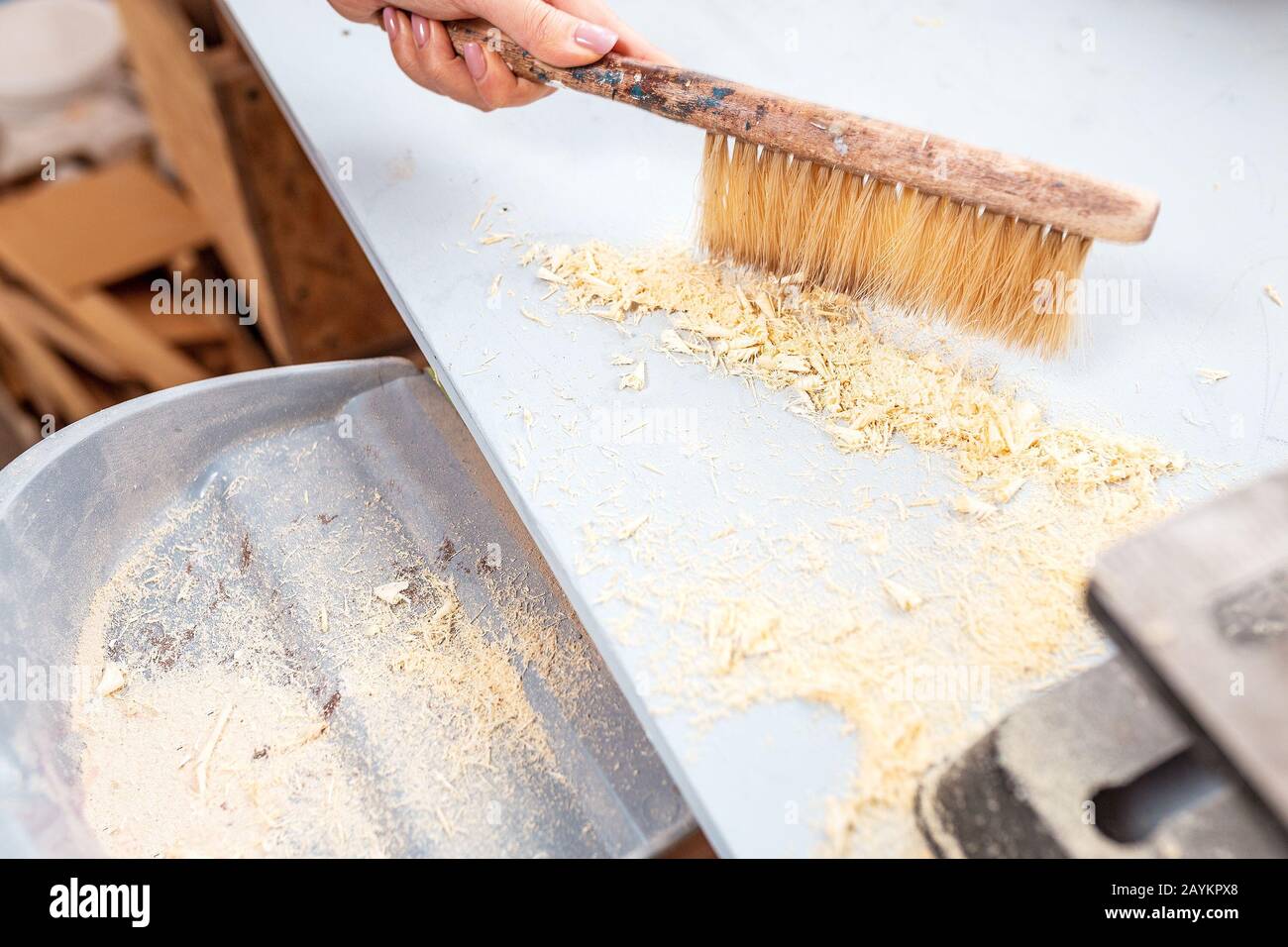 brush sweeping wood shavings in carpentry workshop Stock Photo - Alamy