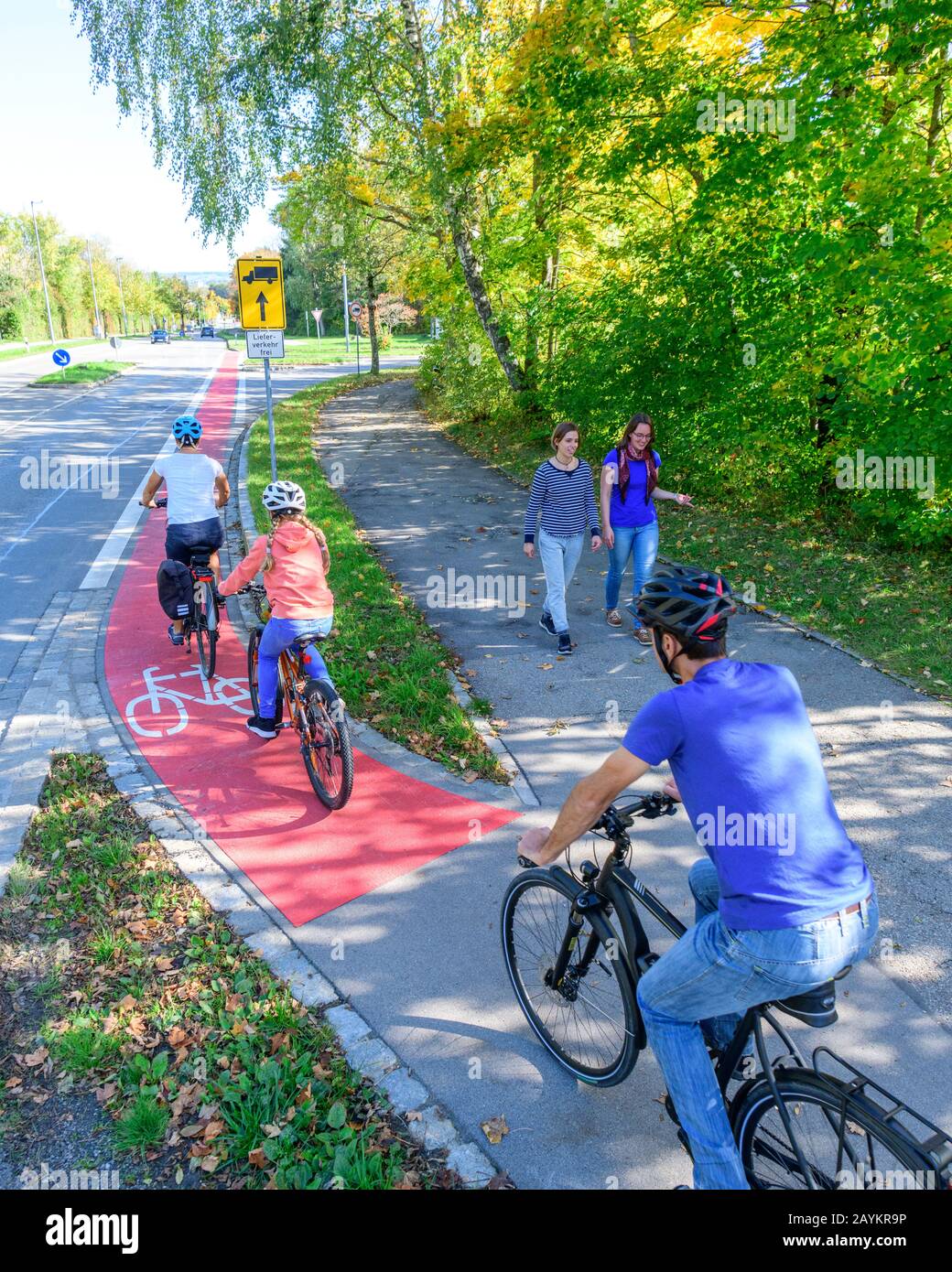 Cyclists changing from the cycle path to a combined cycling road and ...