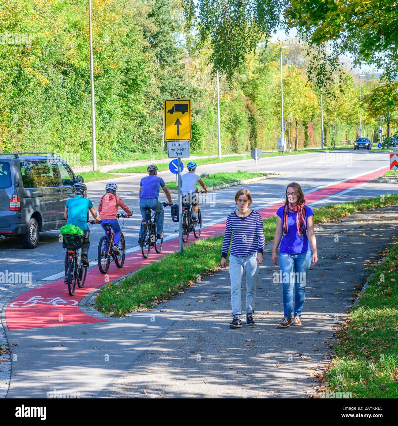 Cyclists changing from the cycle path to a combined cycling road and ...