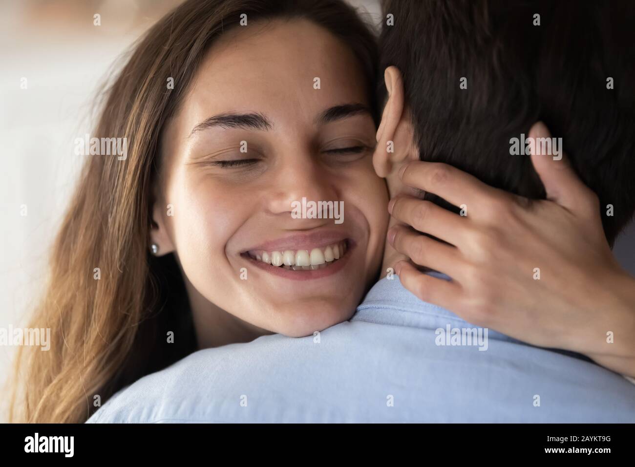 Happy young woman hug beloved husband showing love Stock Photo - Alamy