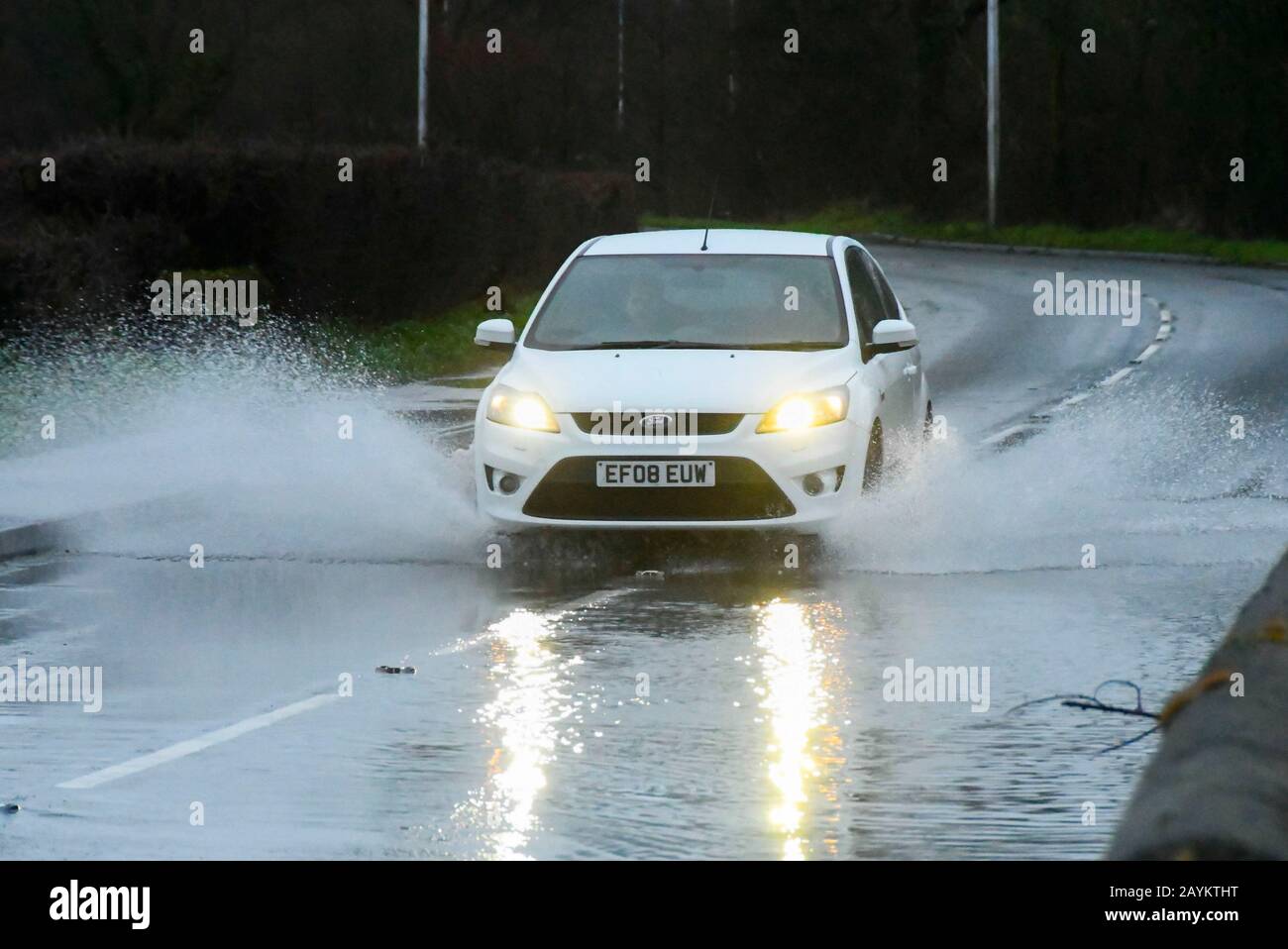 Axminster, Devon, UK. 16th February 2020. UK Weather. A car drives ...