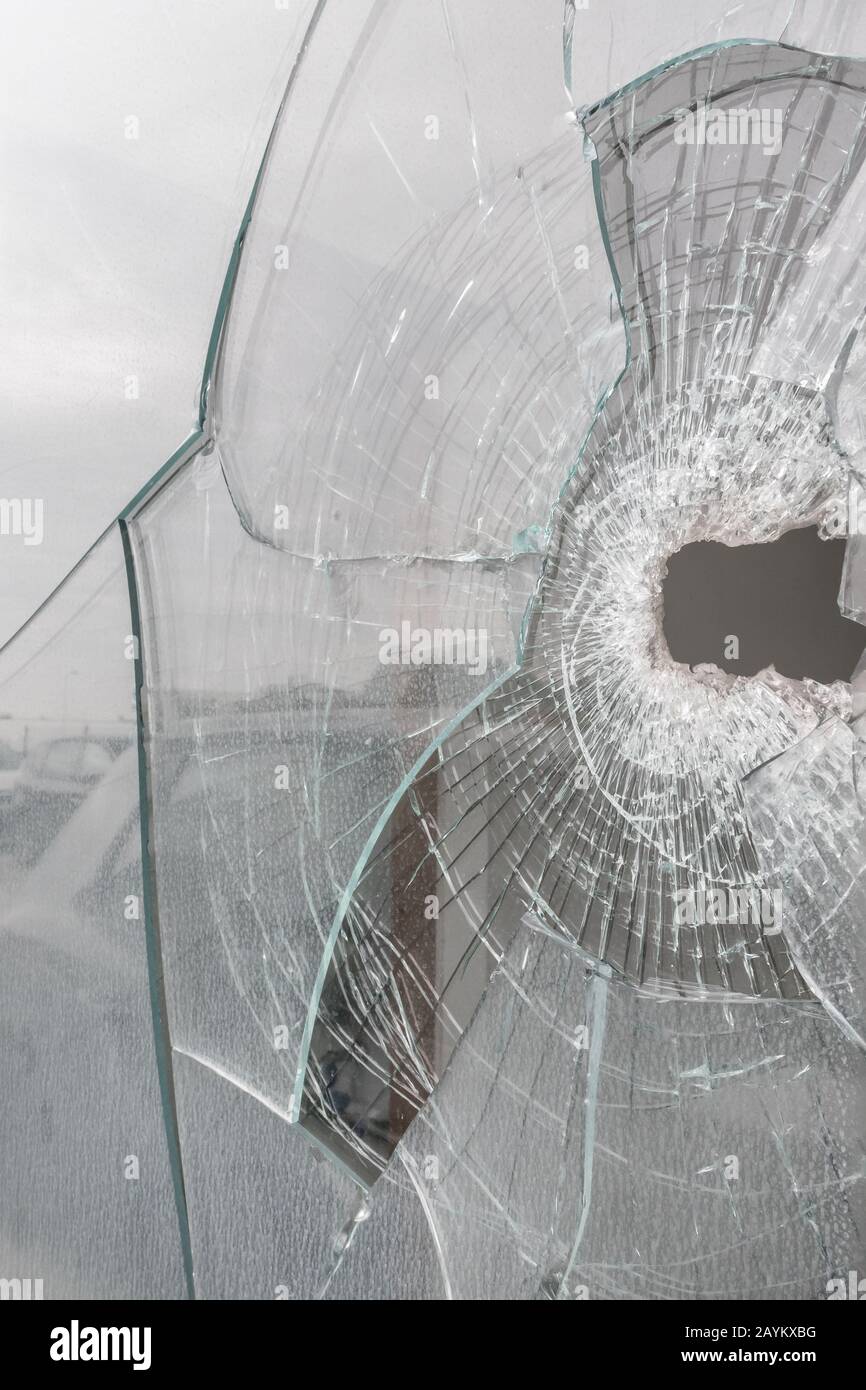 Glass broken with hole and splinters. Ideal for backgrounds and ...