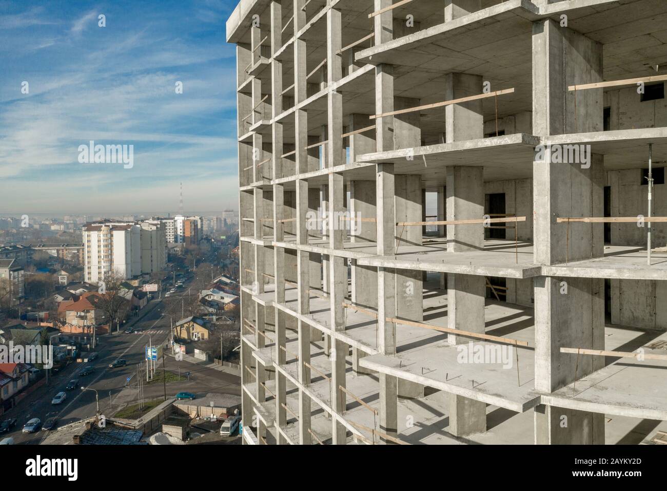 Aerial view of concrete frame of tall apartment building under ...