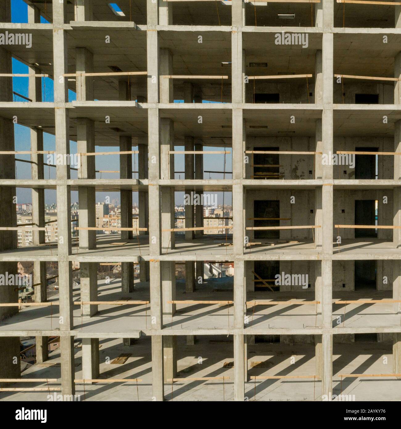 Aerial view of concrete frame of tall apartment building under ...