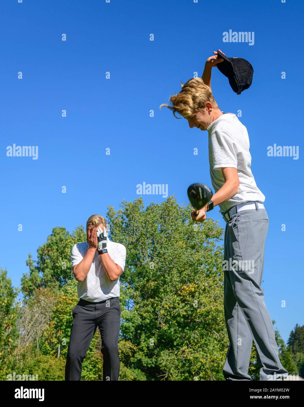 Emotional young golf player gets angry after bad drive Stock Photo - Alamy