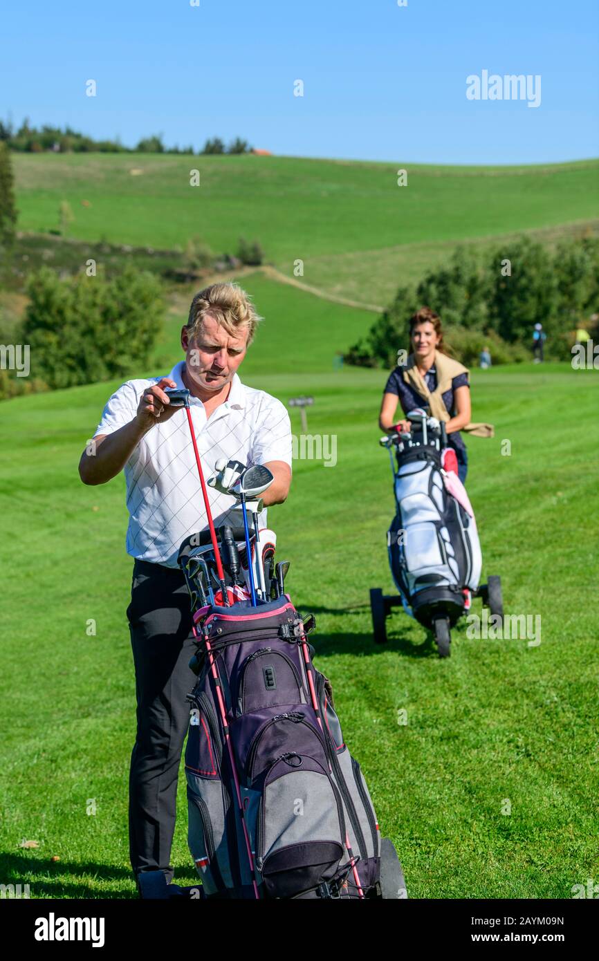 Family flight on the way on golf course Stock Photo - Alamy