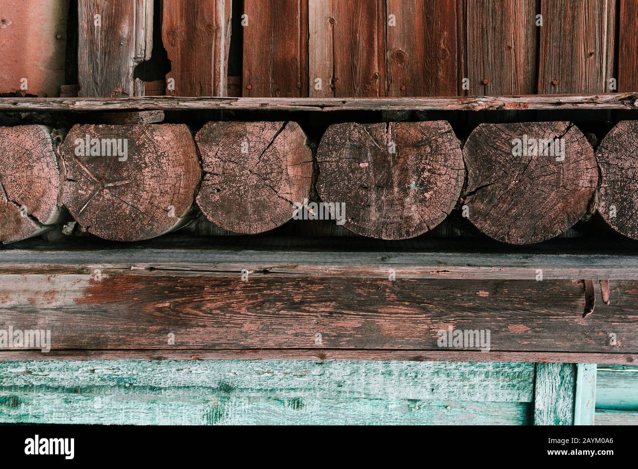 Wall of an old wooden house. Round wood bars and planks Stock Photo - Alamy