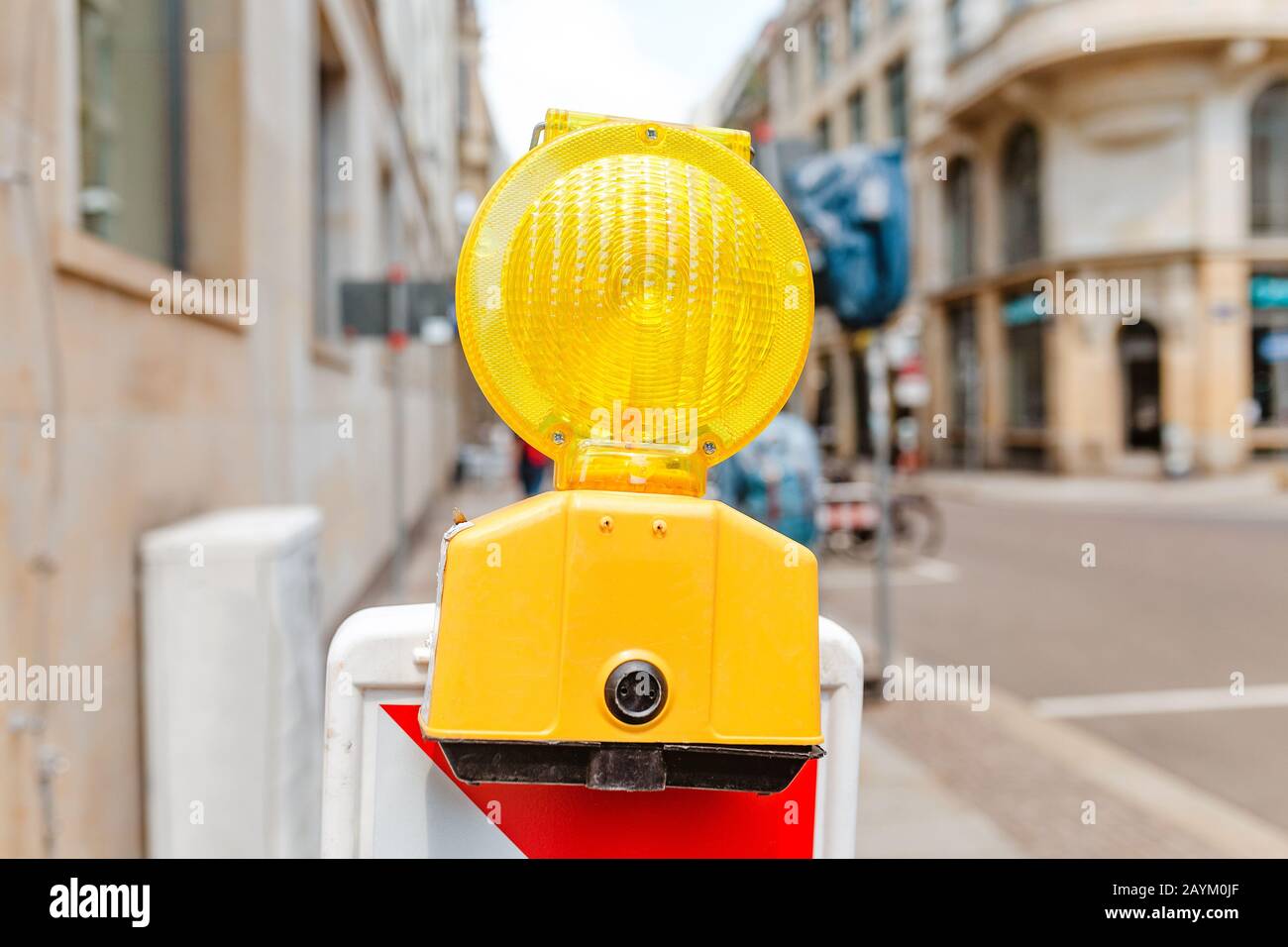 yellow signal lamp warning against a building construction site Stock ...
