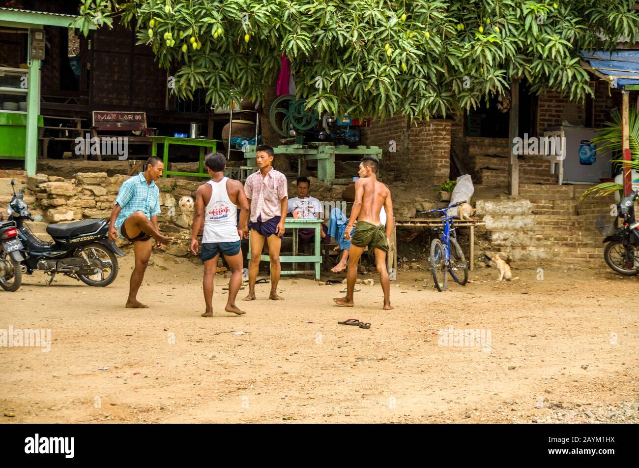 Local Burmese playing chinlone or caneball, traditional national sport ...