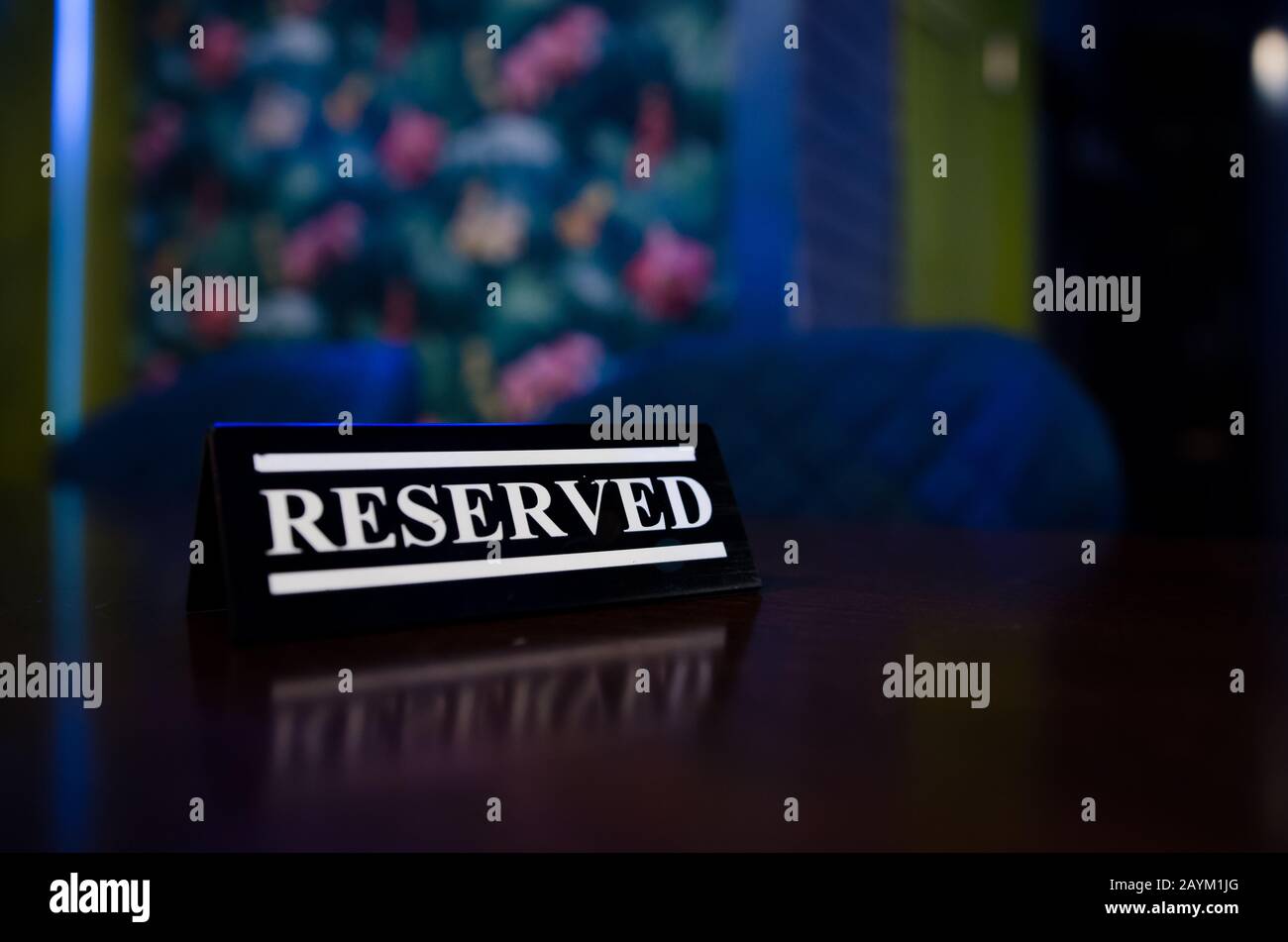 Restaurant reserved table sign. Interior of trendy cafe, copy space ...