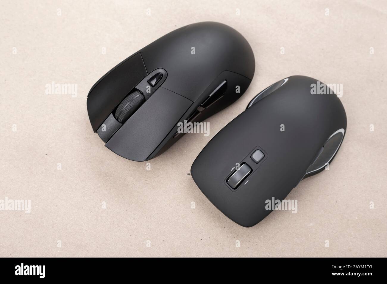 Two wireless computer mouse on a paper background Stock Photo - Alamy