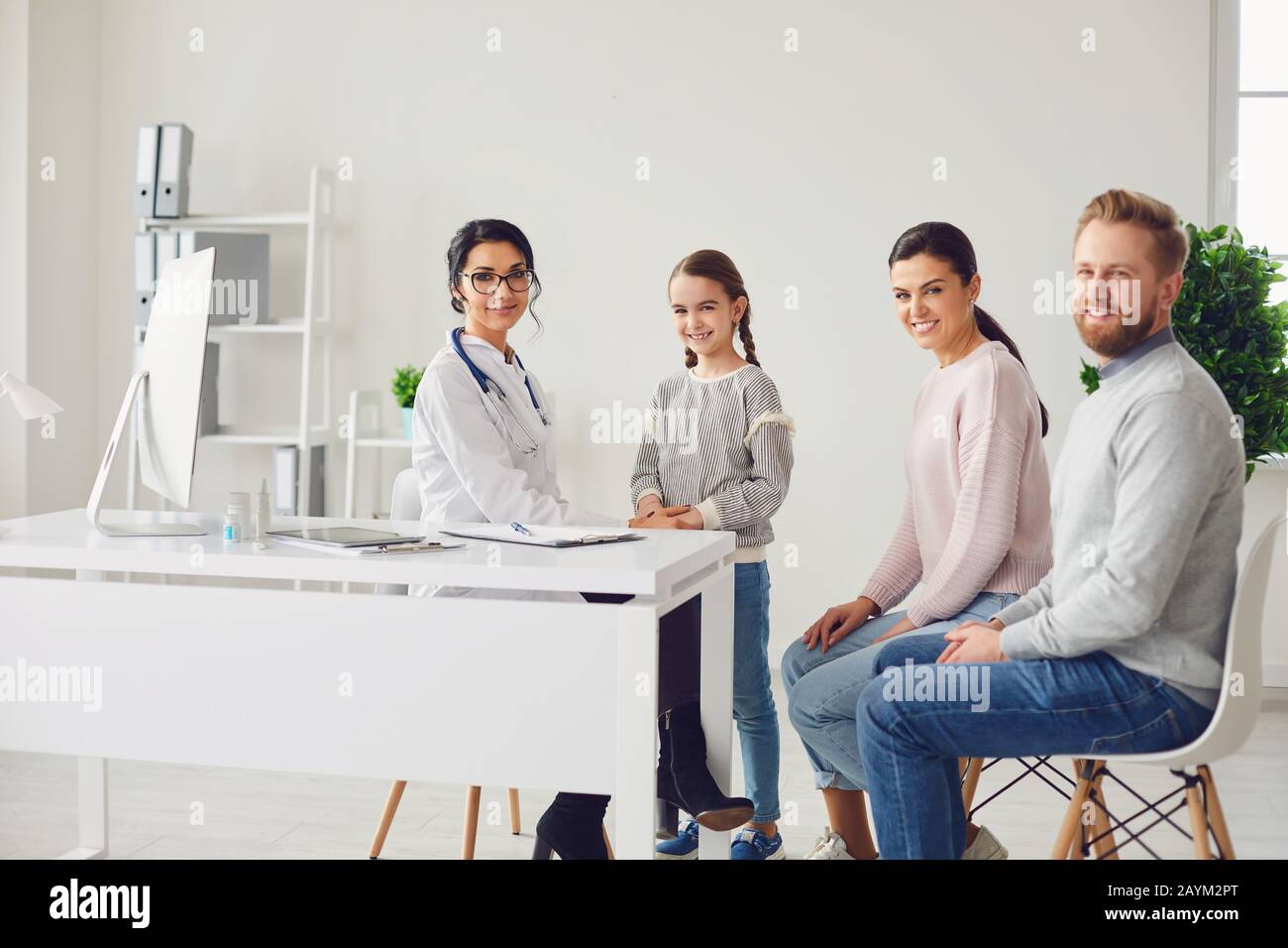 Happy family at the doctors visit at office Stock Photo - Alamy