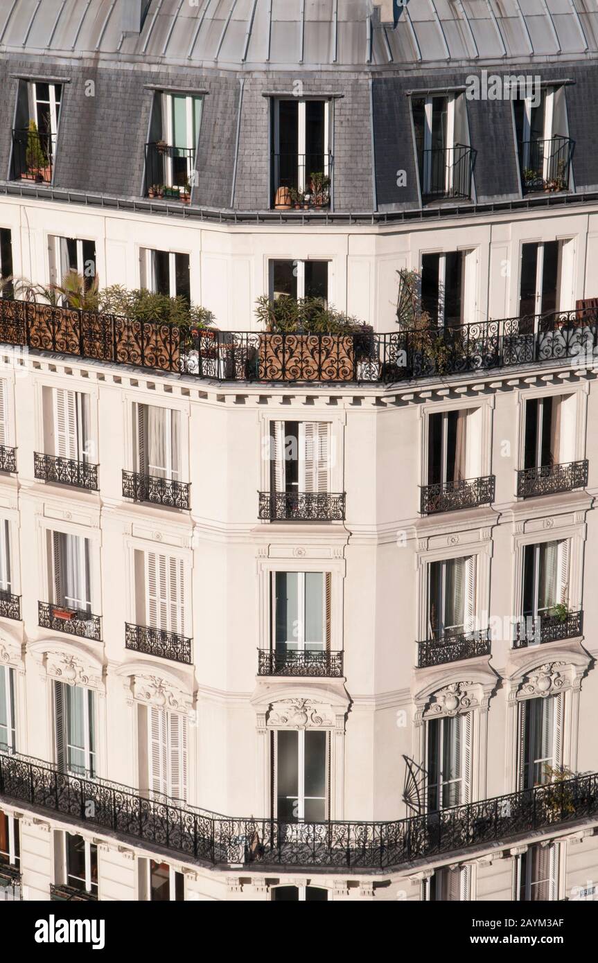 Sunny view of the Paris cityscape with traditional Haussmann ...