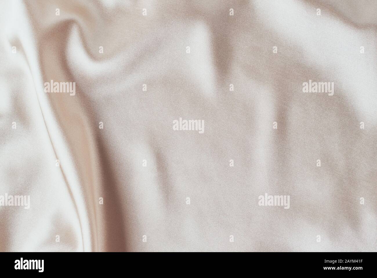 Golden light silk background with folds. Abstract texture of rippled ...