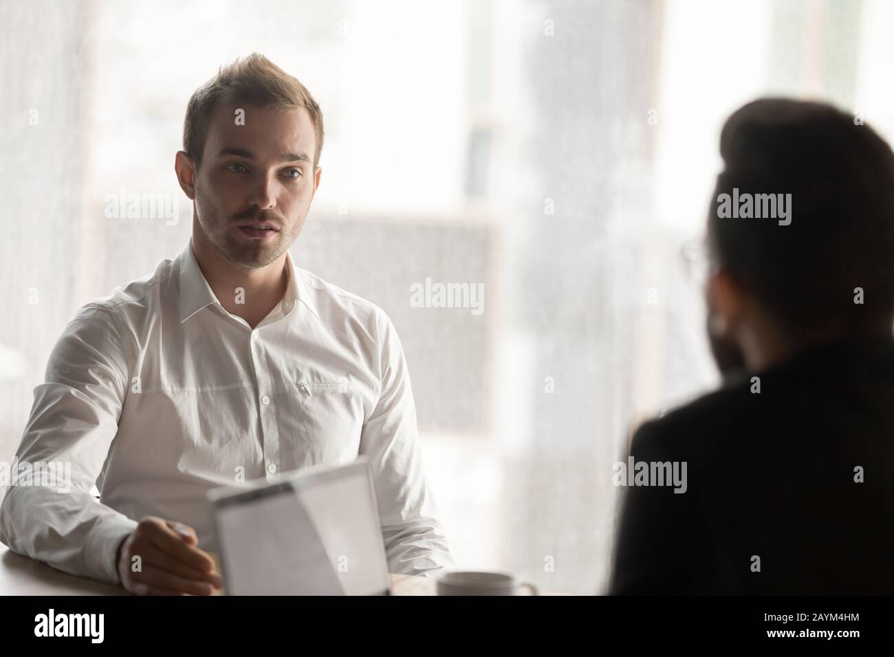 European applicant answering of questions during job interview in ...