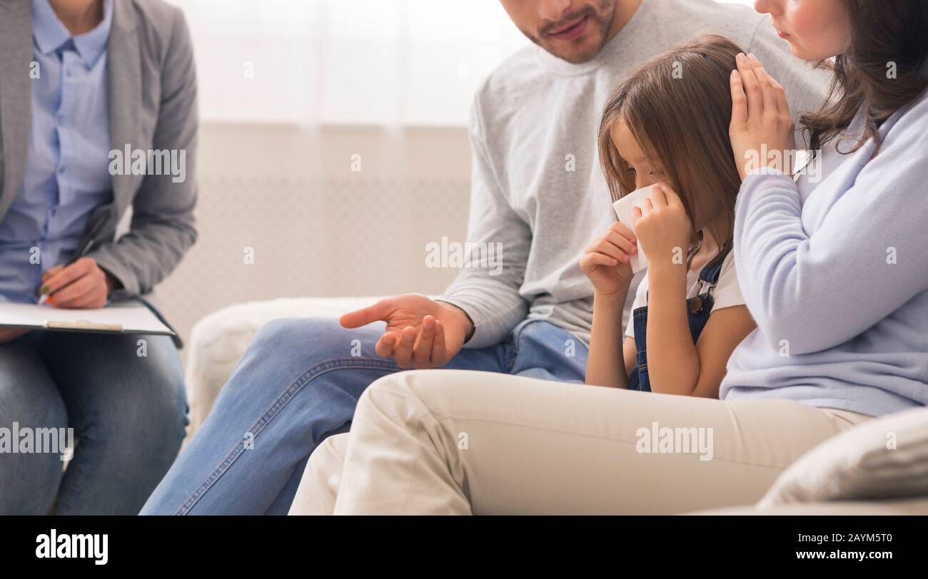 Little Girl Crying In Children Psychologist's Office, Caring Parents ...