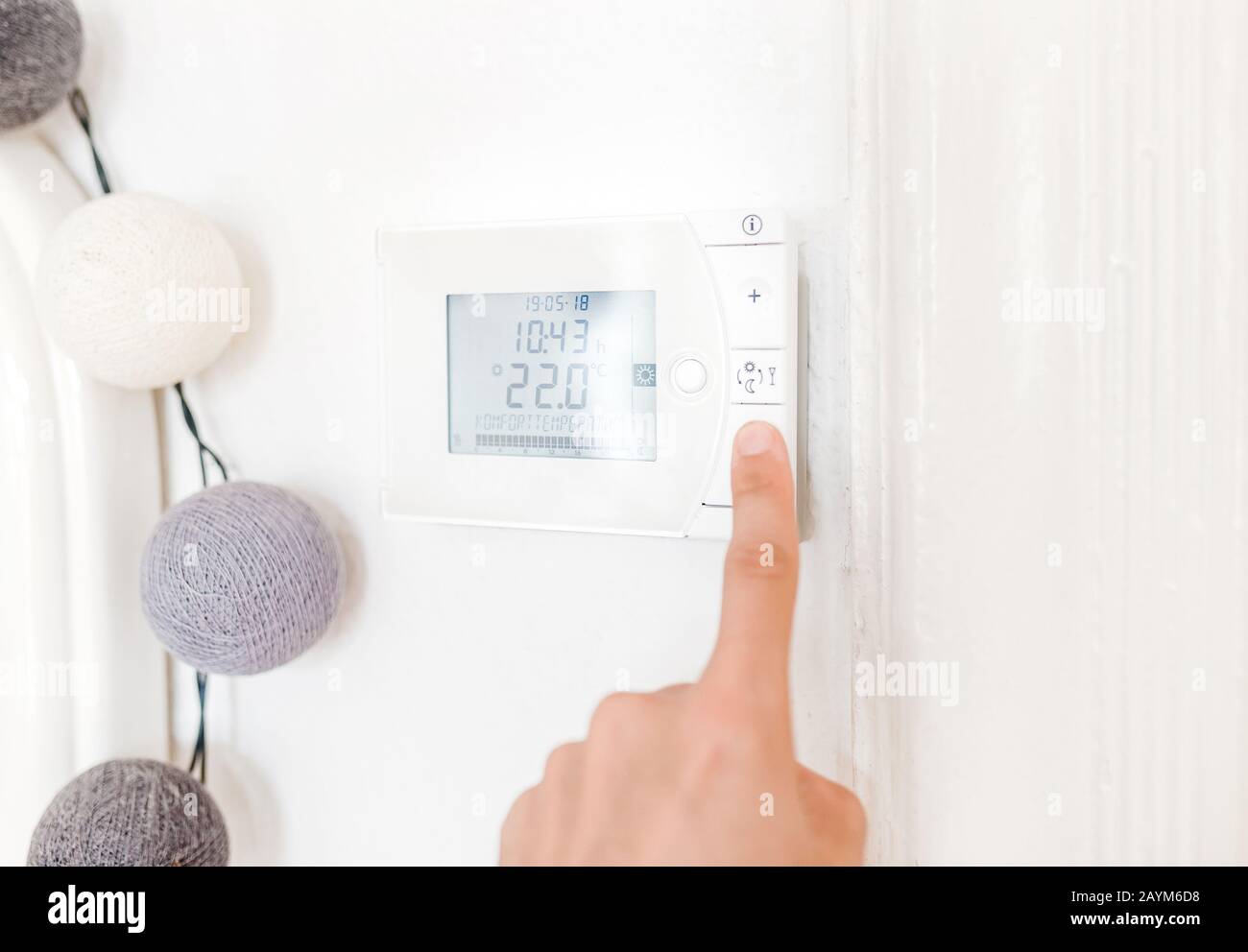 Turning up the heating hi-res stock photography and images - Alamy