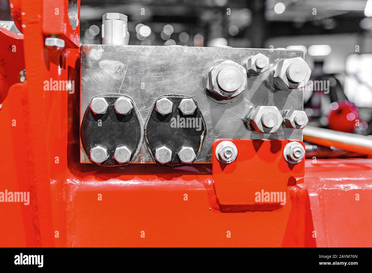 Bolts fastening a red metal construction Stock Photo - Alamy