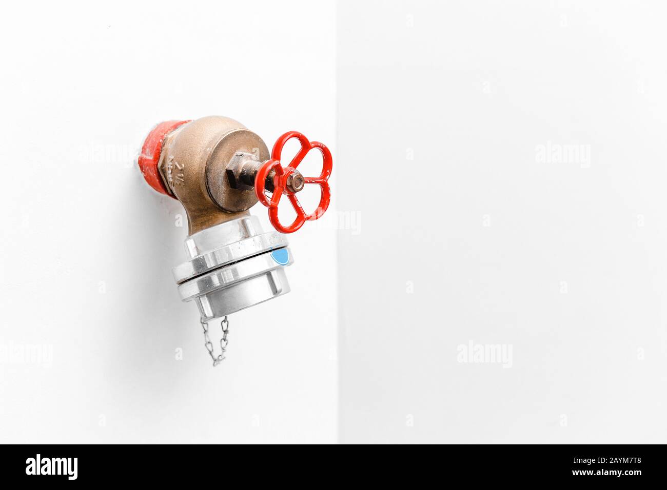 Opened Fire Hydrant on a white wall Stock Photo - Alamy