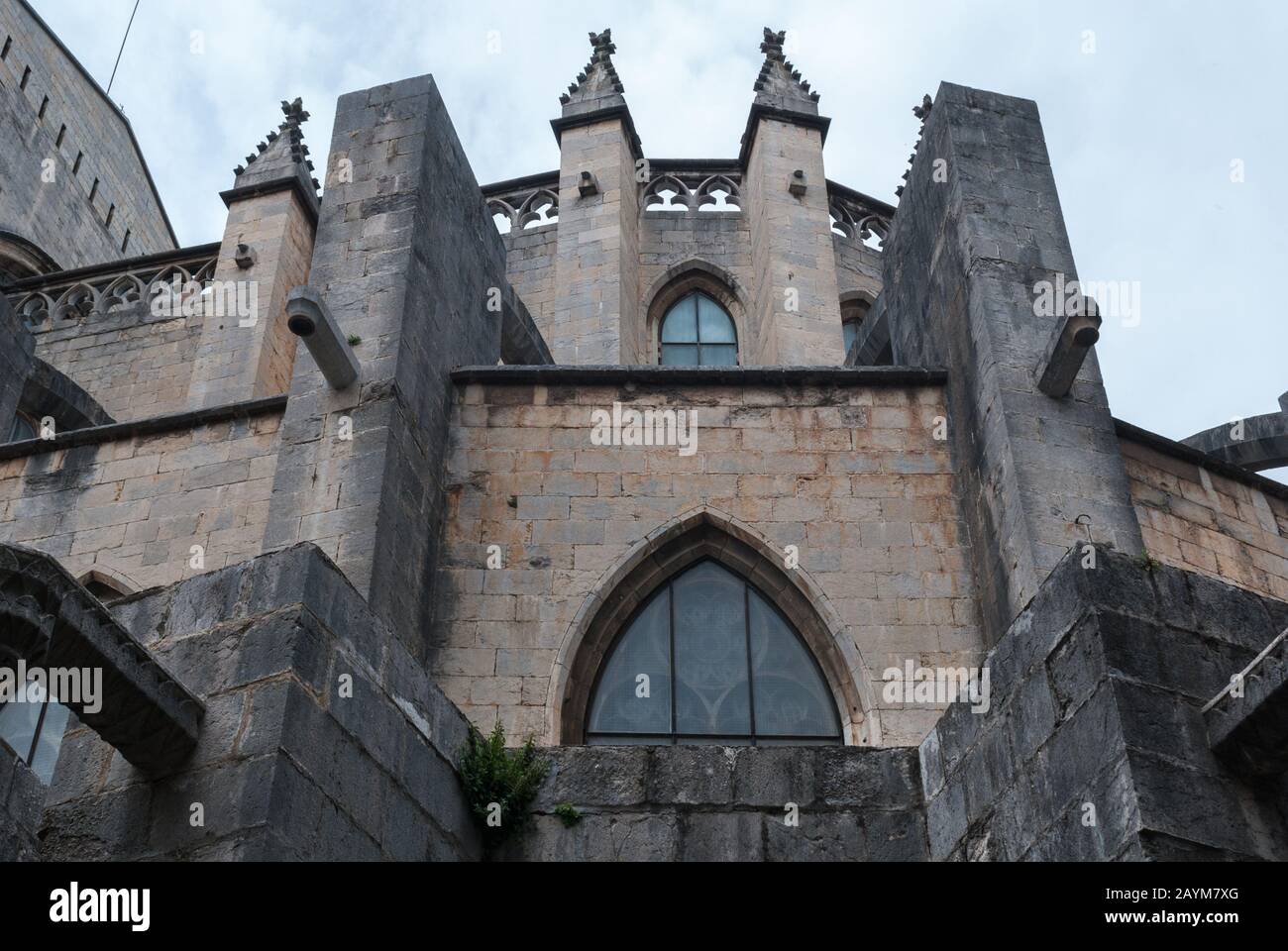 View of the top of an old cathedral of a medieval town. Gothic-style ...