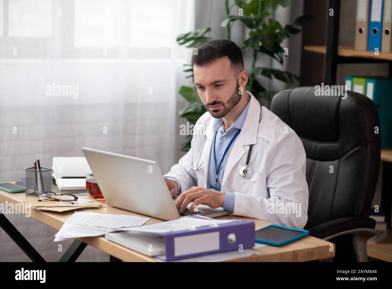 Young bearded doctor on hi-res stock photography and images - Alamy