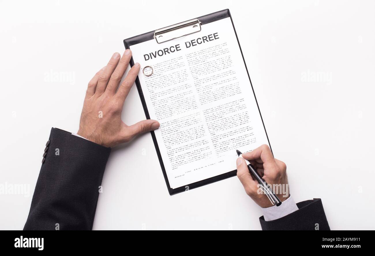 Hands of husband signing decree of divorce, canceling marriage Stock ...