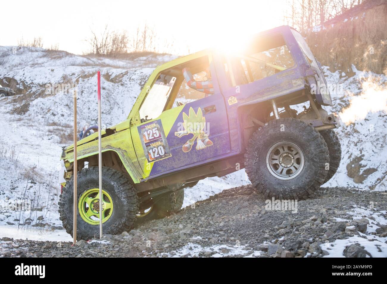 Jeep Suzuki Jimny overcomes obstacles in the forest Stock Photo - Alamy