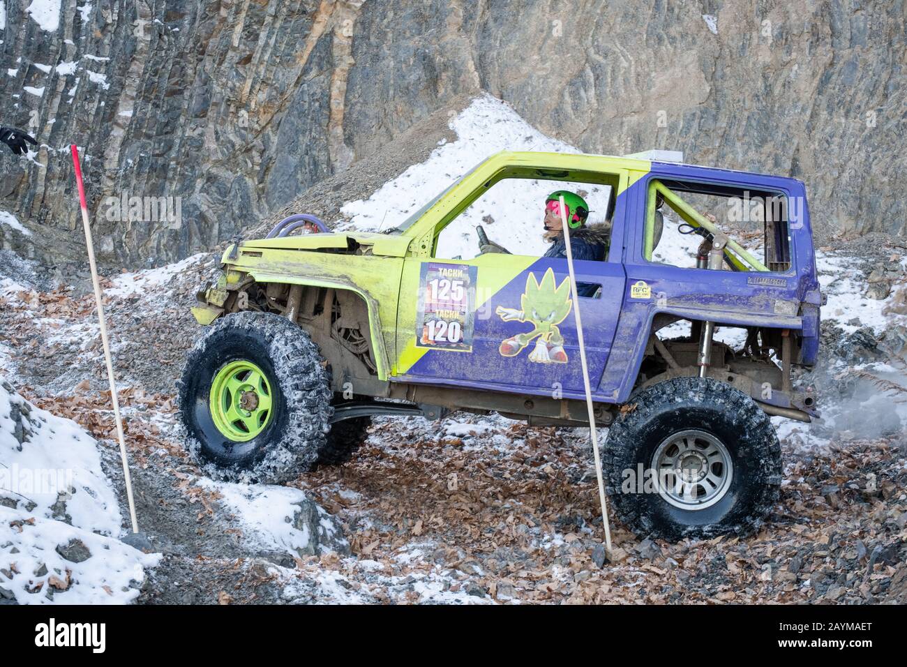 Jeep Suzuki Jimny overcomes obstacles in the forest Stock Photo - Alamy