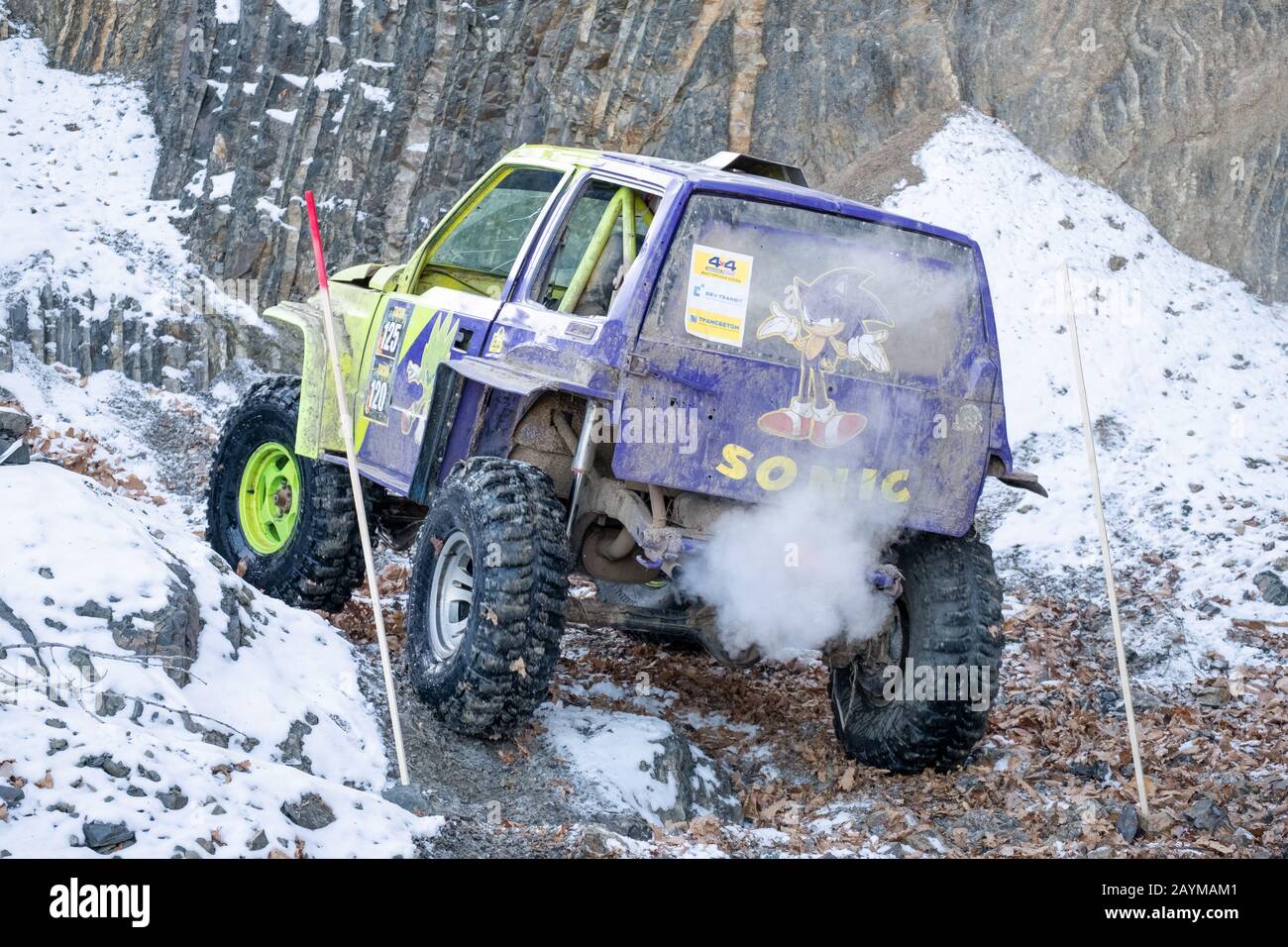 Jeep Suzuki Jimny overcomes obstacles in the forest Stock Photo - Alamy