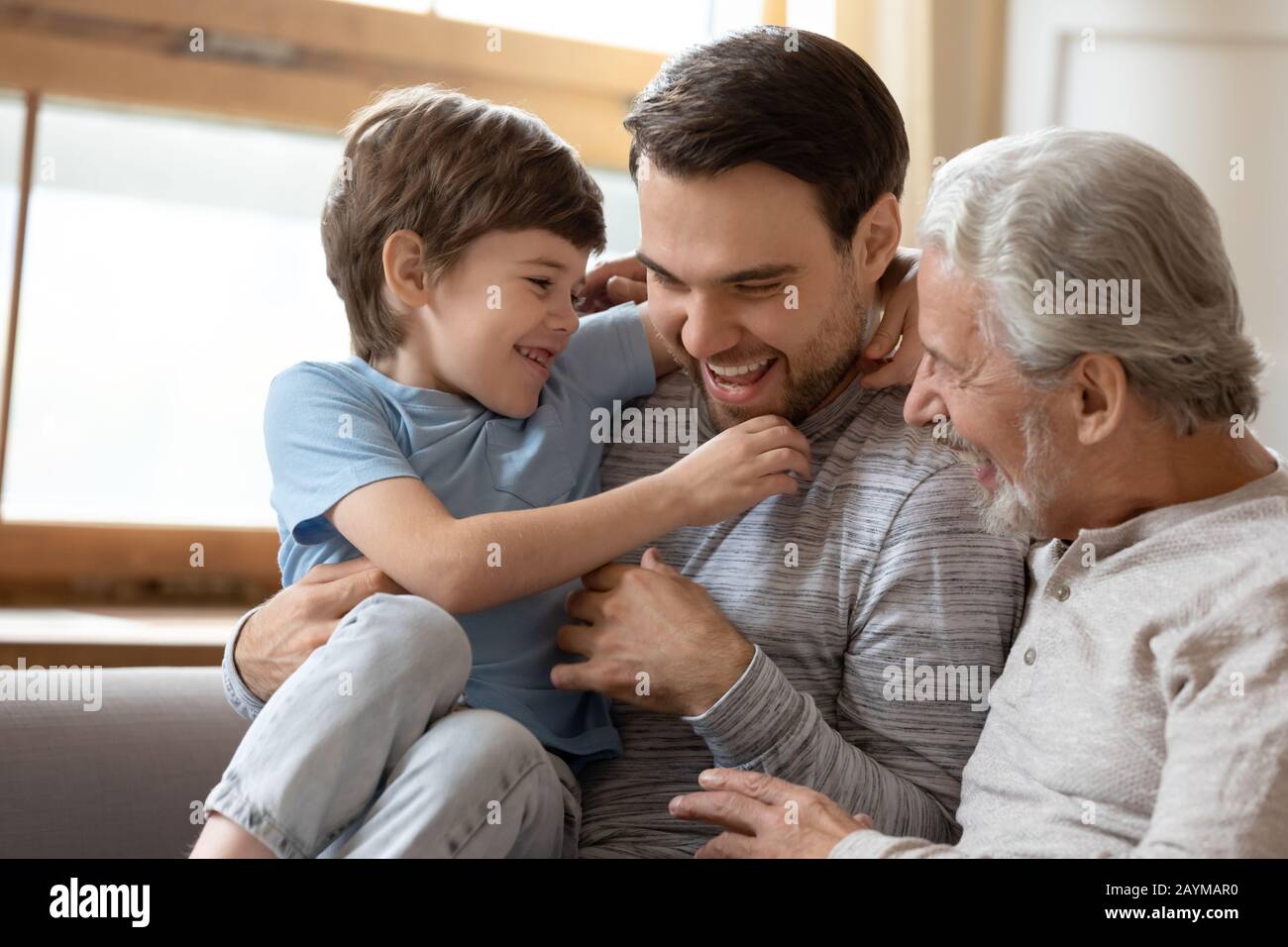 Joyful laughing different generations carefree family having fun ...