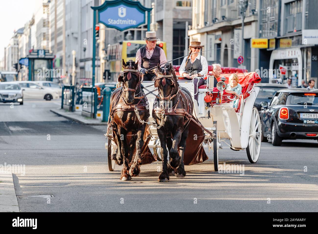 BERLIN, GERMANY - 20 MAY 2018: Tourists ride on traditional coach with ...