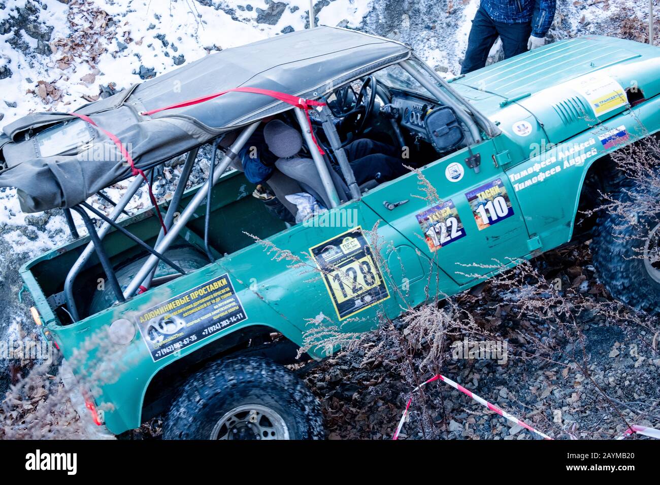 Jeep Suzuki Jimny overcomes obstacles in the forest Stock Photo - Alamy
