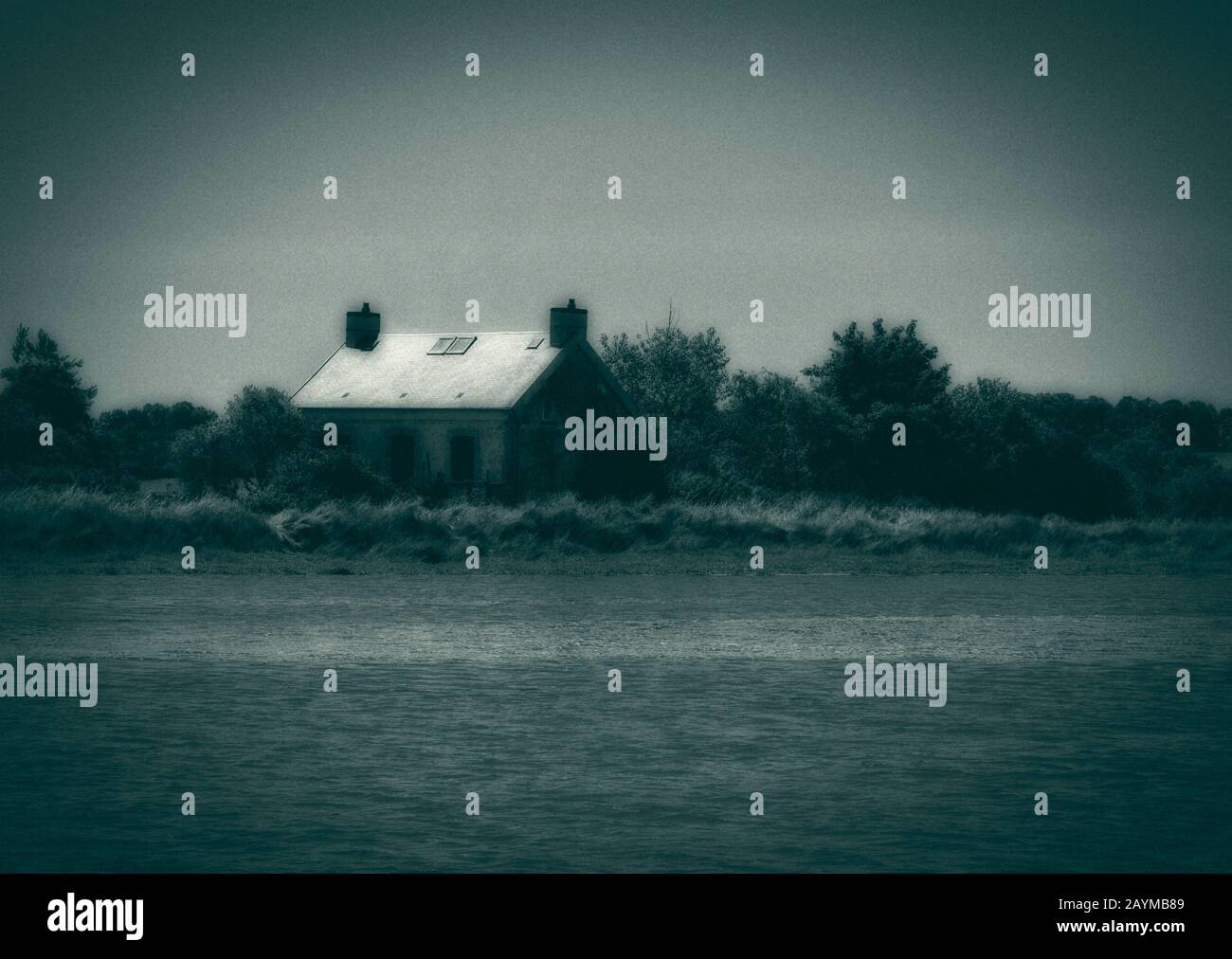 isolated building on the edge of a salt marsh and river estuary Stock ...