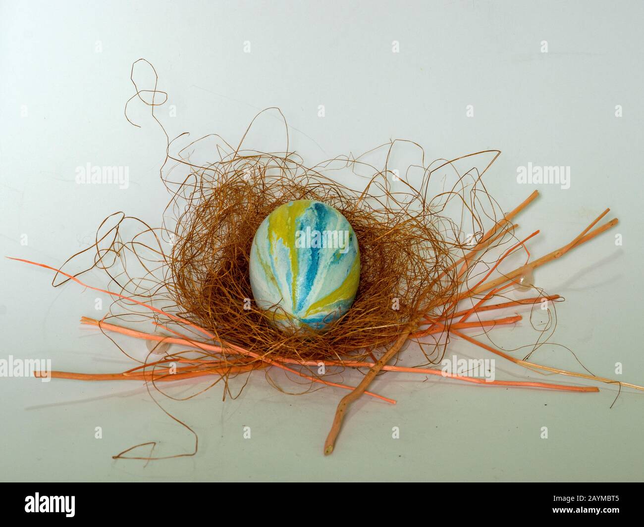 picture with eggs on a stylized bird's nest Stock Photo - Alamy
