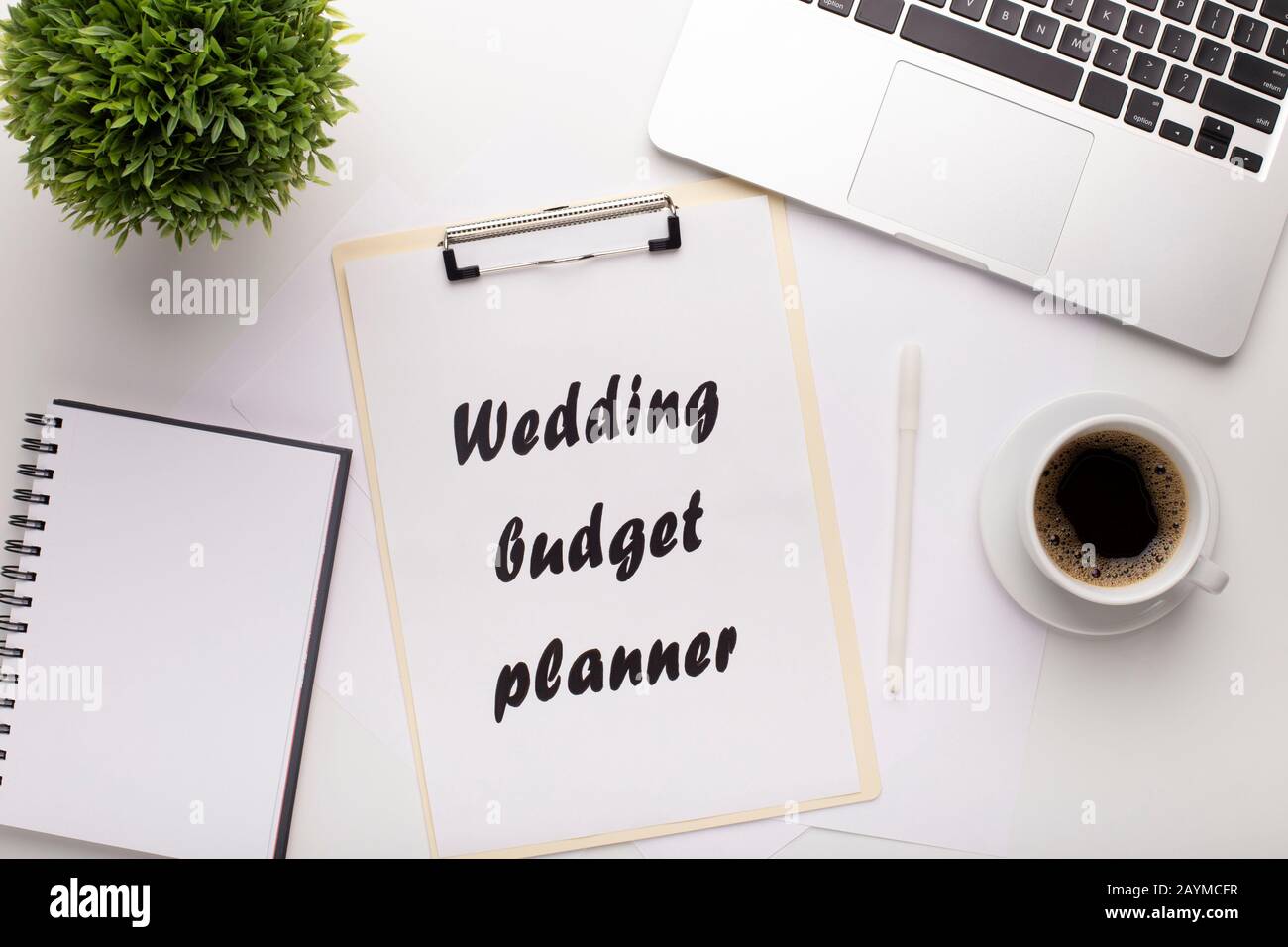 Modern workplace with laptop and wedding budget planner Stock Photo - Alamy