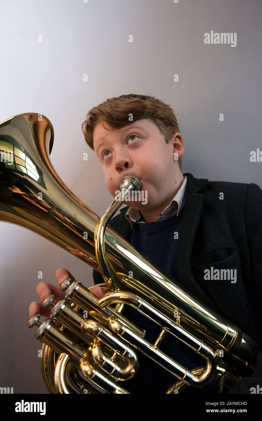 12-year old boy playing a Baritone horn Stock Photo - Alamy