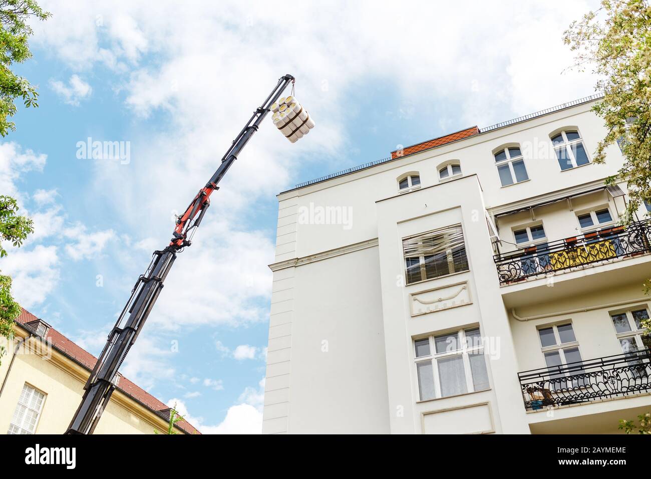 Repair and restoring facade of a building using crane lifter Stock ...