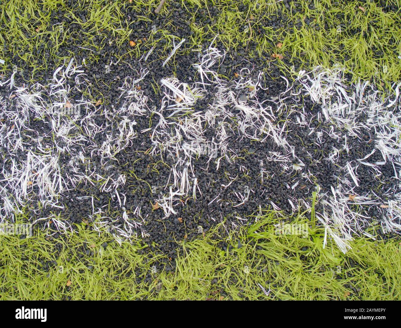Rubbery base of soccer turf. Green synthetic artificial grass soccer ...