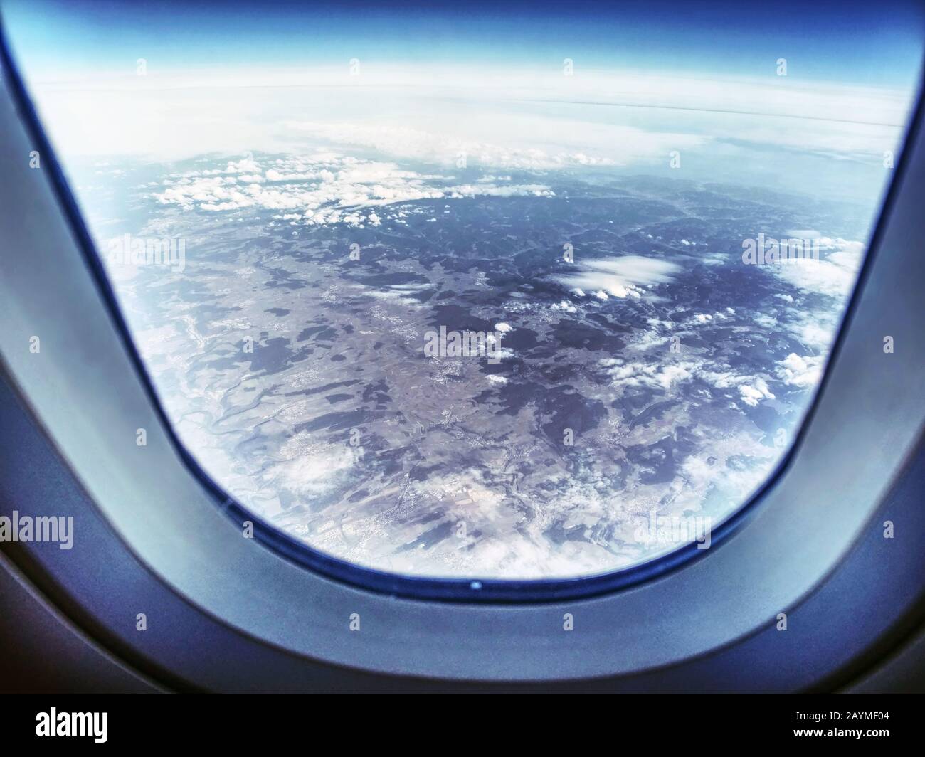 Flying plane with a view on a landscape from a window. Part of Europe ...