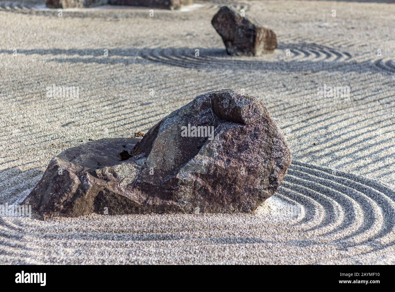 Japanese dry rock zen landscape garden, or karesansui, with raked sand ...