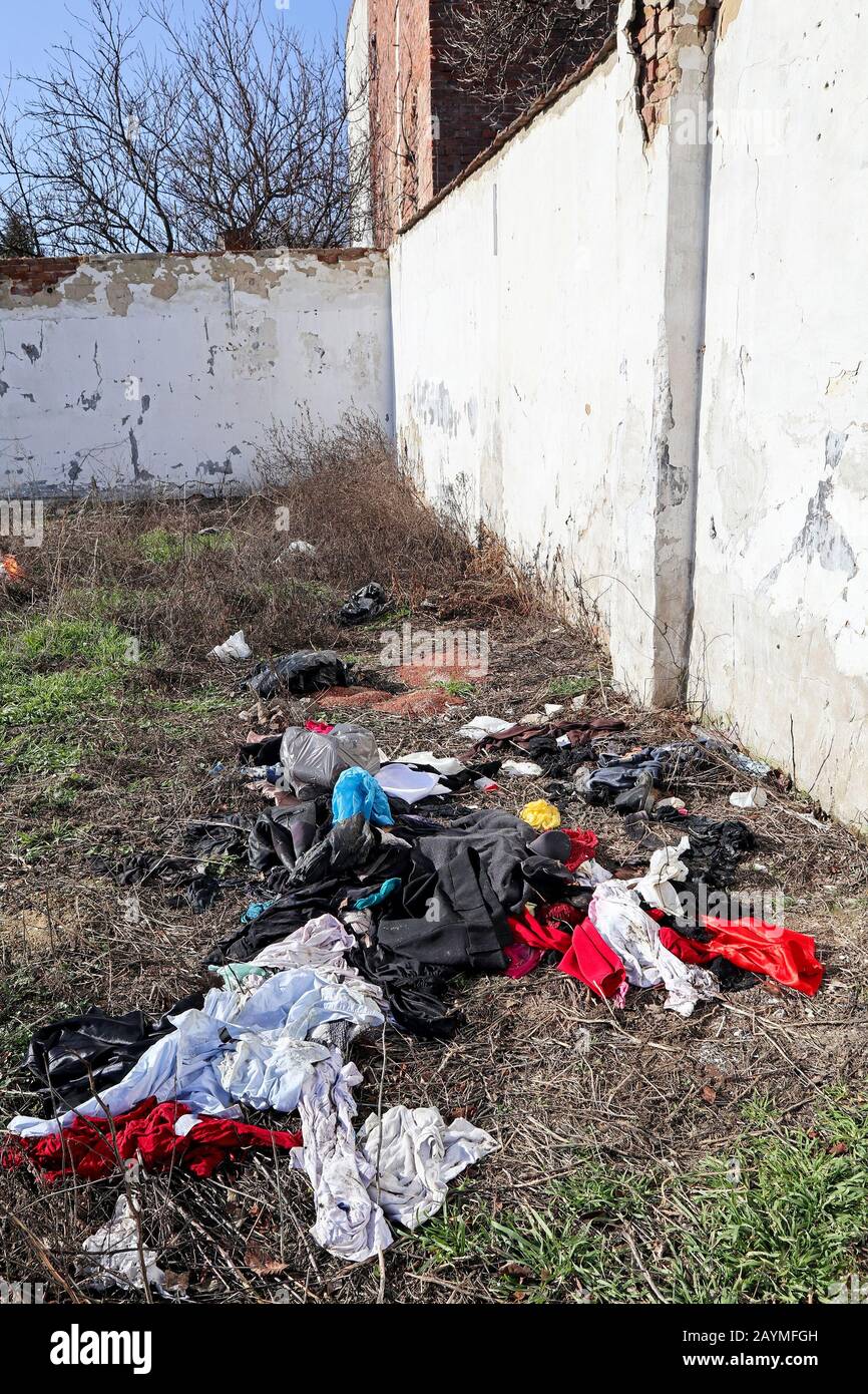 Old clothes trash on the street Stock Photo - Alamy