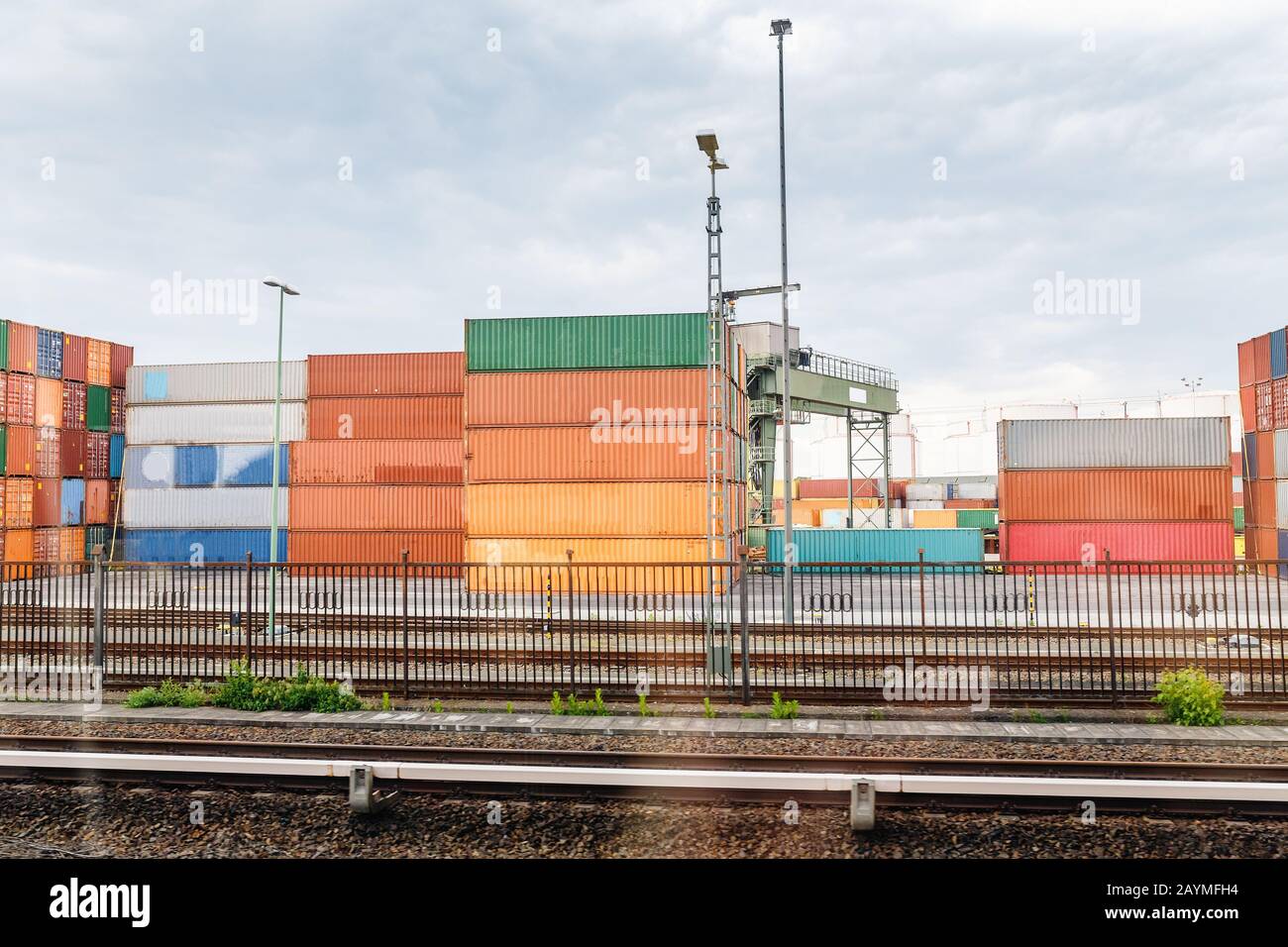 Stack of Cargo Containers at the railway station Stock Photo - Alamy