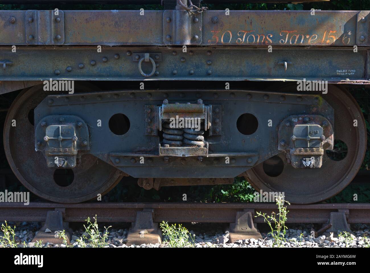 close up of wheels and suspension on an old flatbed truck in the ...