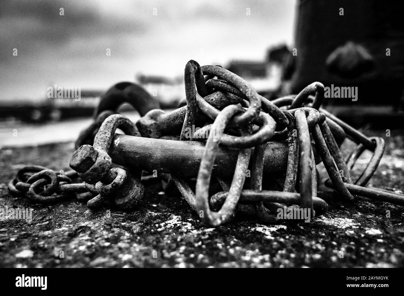 Old Harbour wall chain in Tenby Wales UK Stock Photo - Alamy