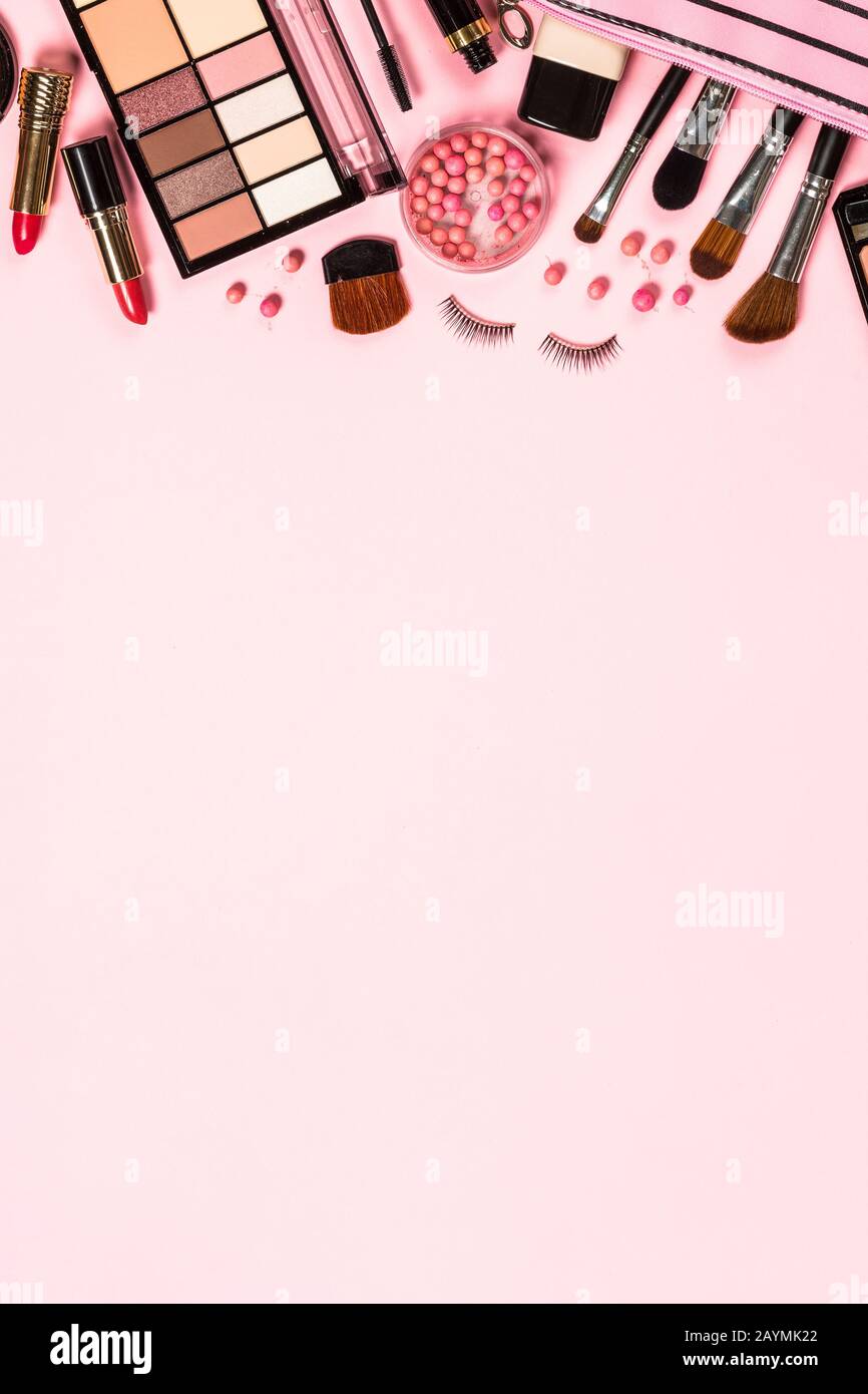 Makeup professional cosmetics on pink background Stock Photo - Alamy