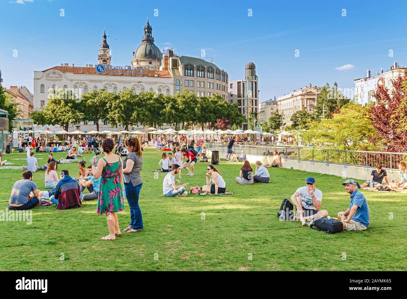 13 MAY 2018, BUDAPEST, HUNGARY: Crowd of people relaxing on the green ...