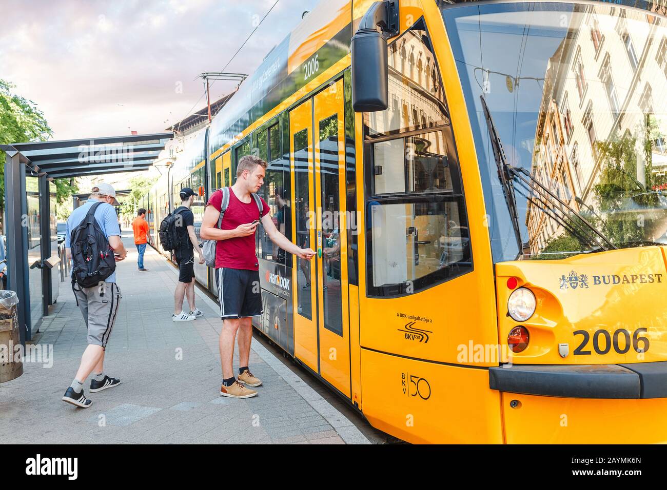 13 MAY 2018, BUDAPEST, HUNGARY: Passengers at the bus stop boarding in ...