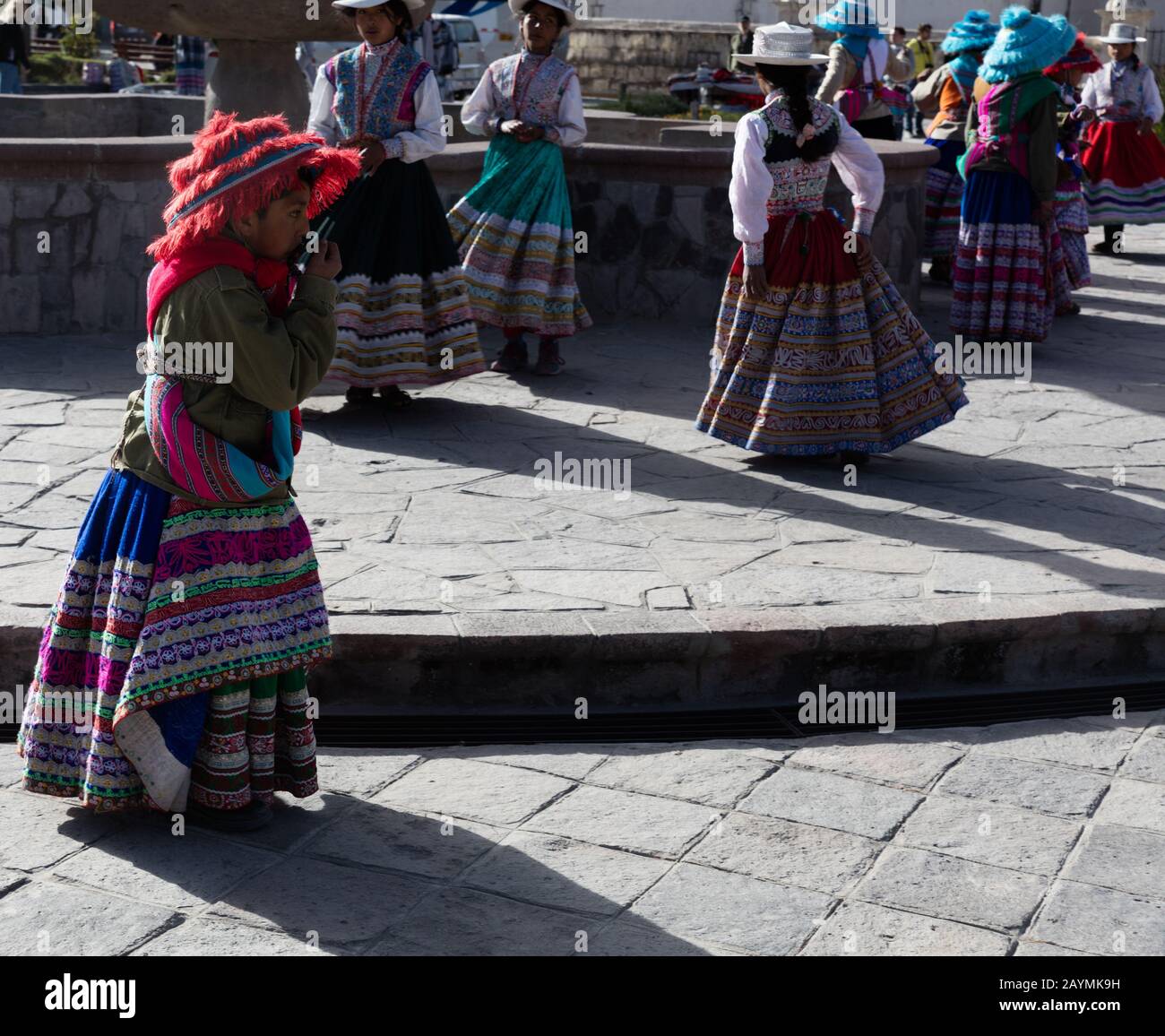 Peruvian Girls With Typical Andean Costumes Dancing In The Main Square