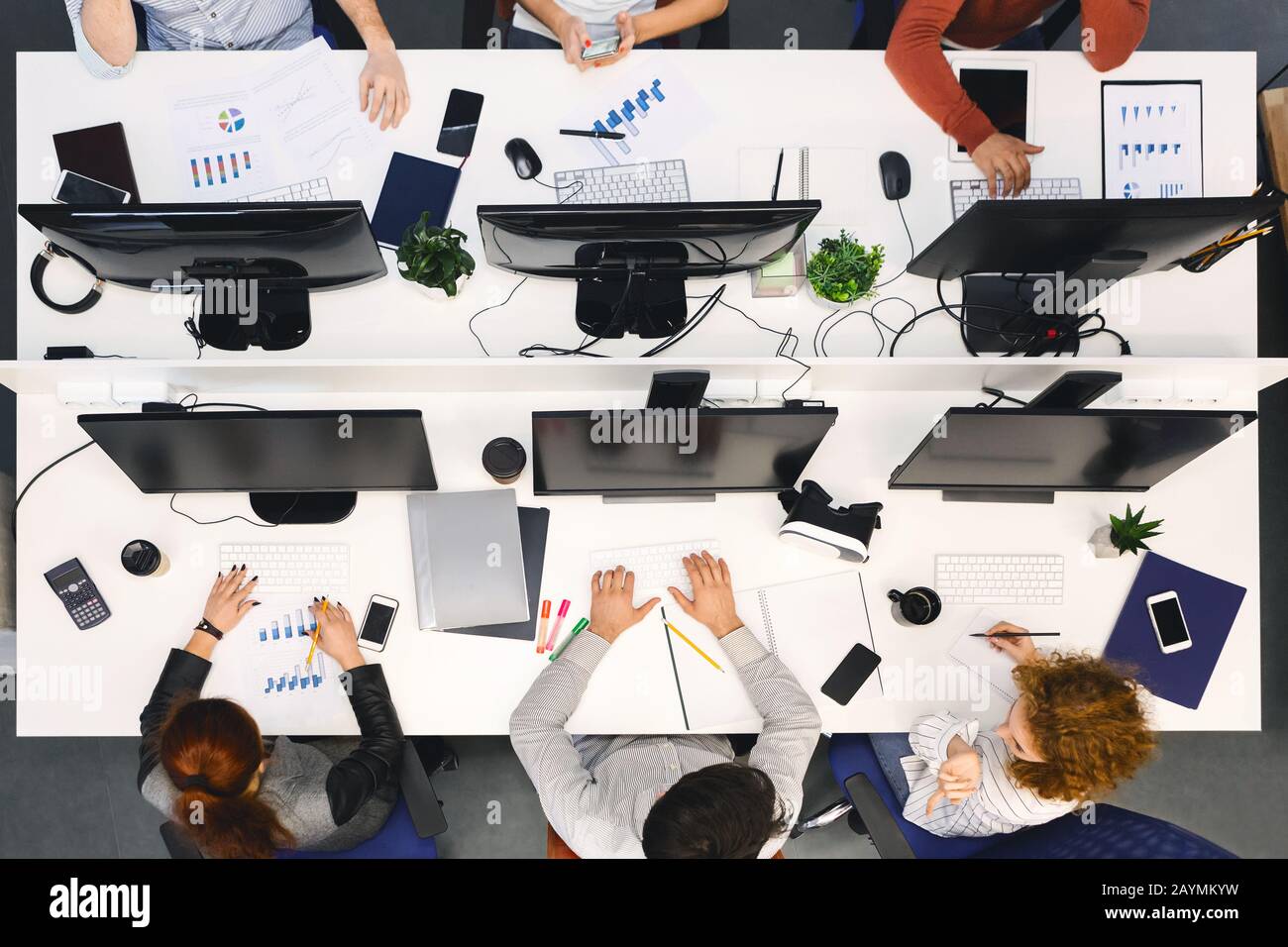 Top view of team working on computers at office Stock Photo - Alamy