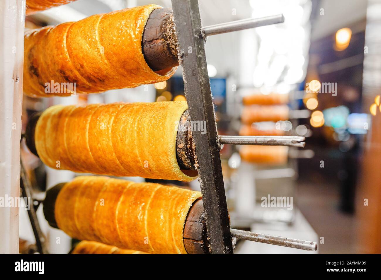 Hungarian round delicacy cake Kurtoskalacs with the cinnamon and brown ...